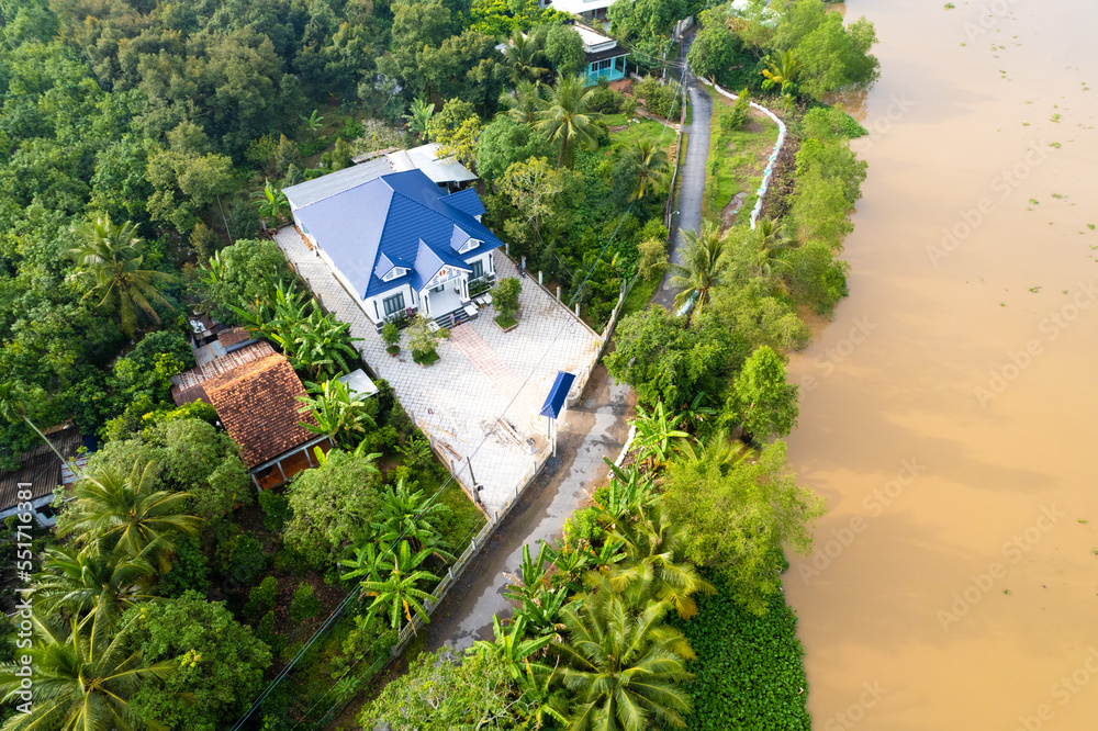 aerial view of Villa house in the middle of the garden with blue tile ...