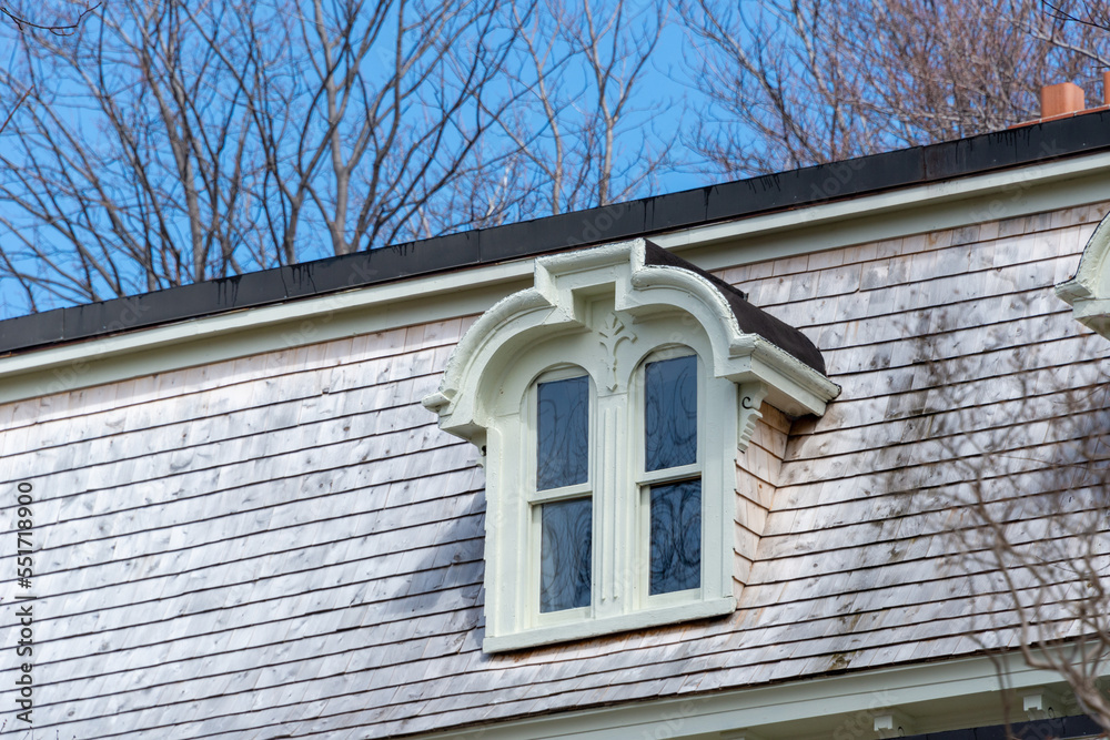 A Hip Roof Of A Vintage Cedar Shakes A Wooden Building With Cream Color Trim The House Has A