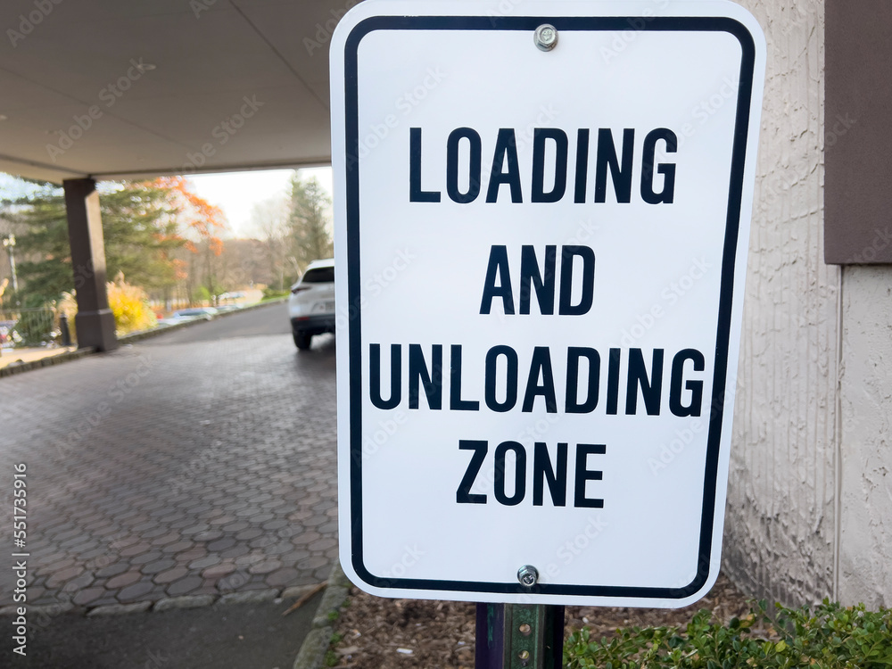 Loading and unloading zone sign Stock Photo | Adobe Stock