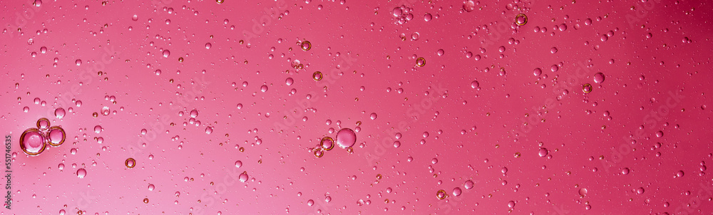 oil with bubbles on Trendy color of 2023 viva magenta. background ...