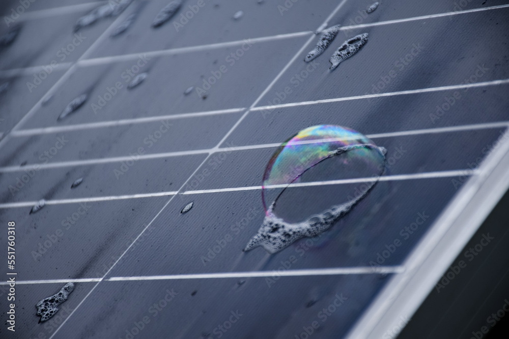 The front surface of photovoltaic or solar cell panel which is wet with ...