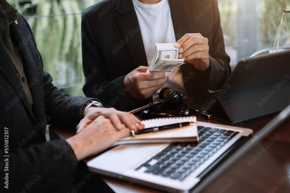 Businessman giving bribe money in the envelope to partner in a ...