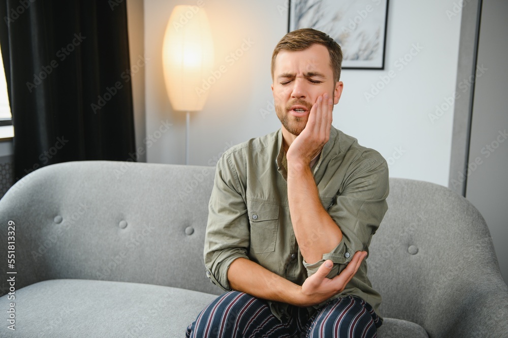 Dental health problems concept. Man suffering from strong toothache ...