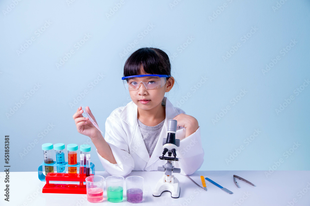 Kid in lab coat learning chemistry in school laboratory, Kid scientist ...