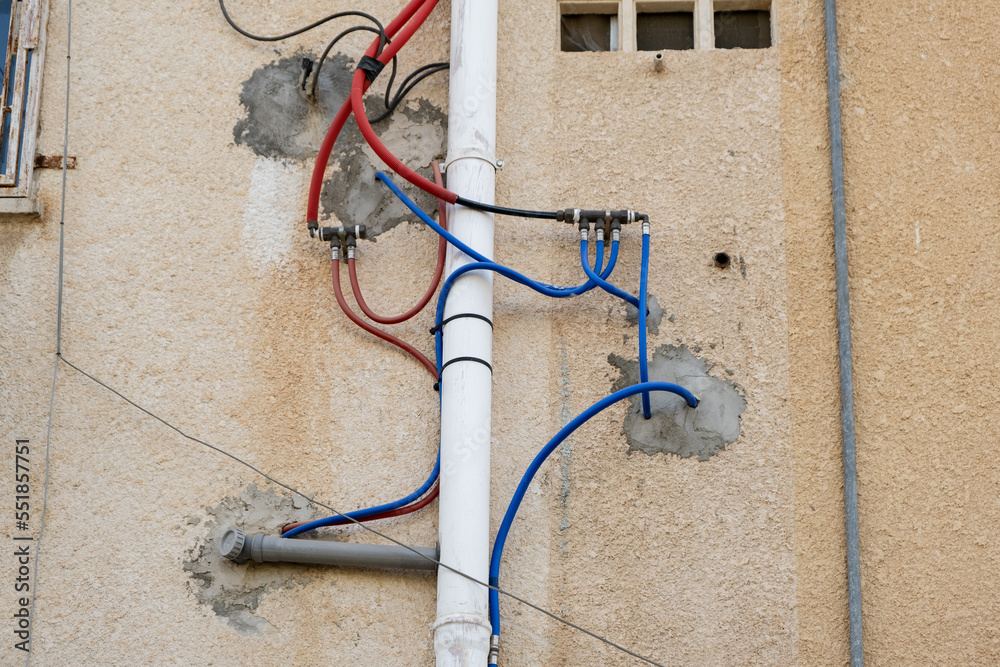 Plumbing installation of water pipe and sewerage system on the building ...