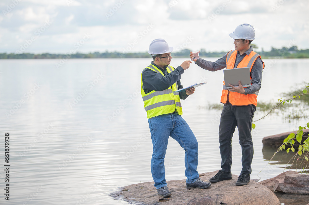 Environmental engineers inspect water quality,Bring water to the lab ...