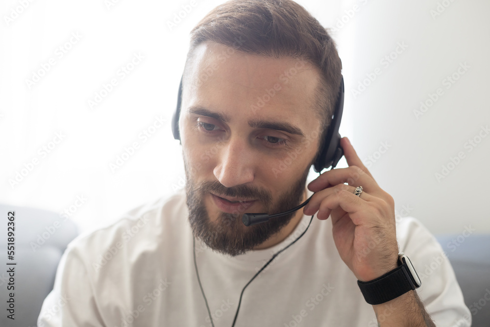 Head shot portrait of handsome smiling man wearing headset at office ...