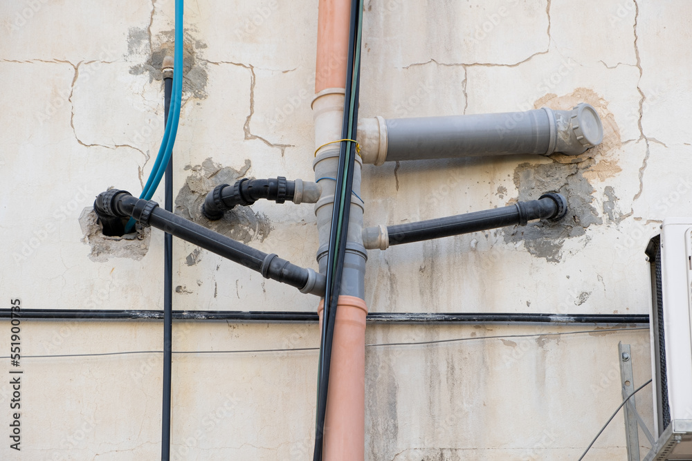 Plumbing installation of water pipe and sewerage system on the building ...