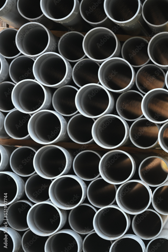 stack of PVC drain pipes on construction site Stock Photo | Adobe Stock