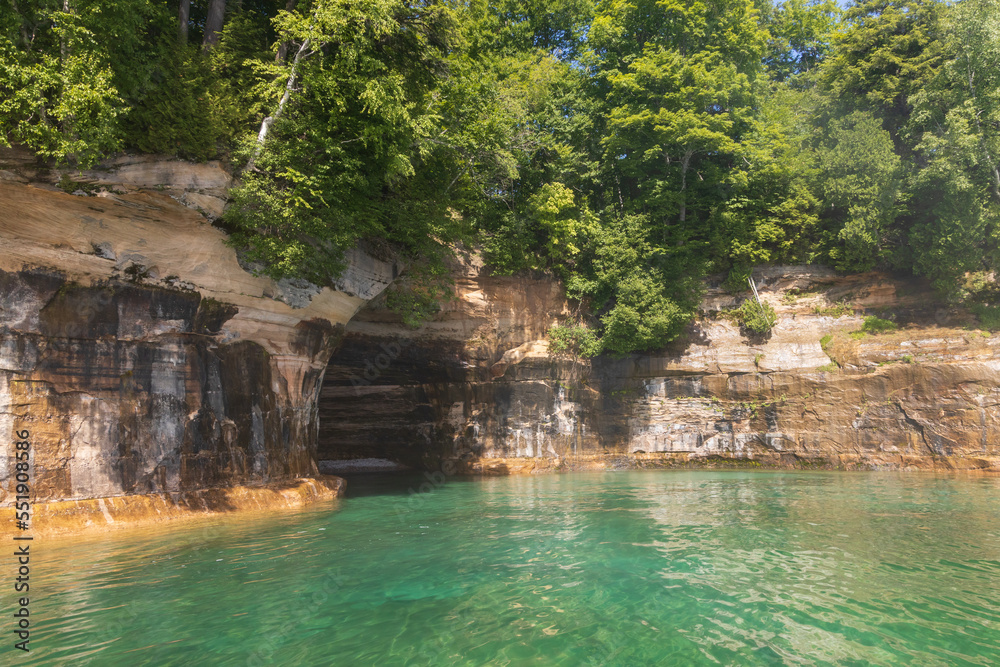 Mineral stained sandstone cliffs along Lake Superior at Pictured Rocks ...