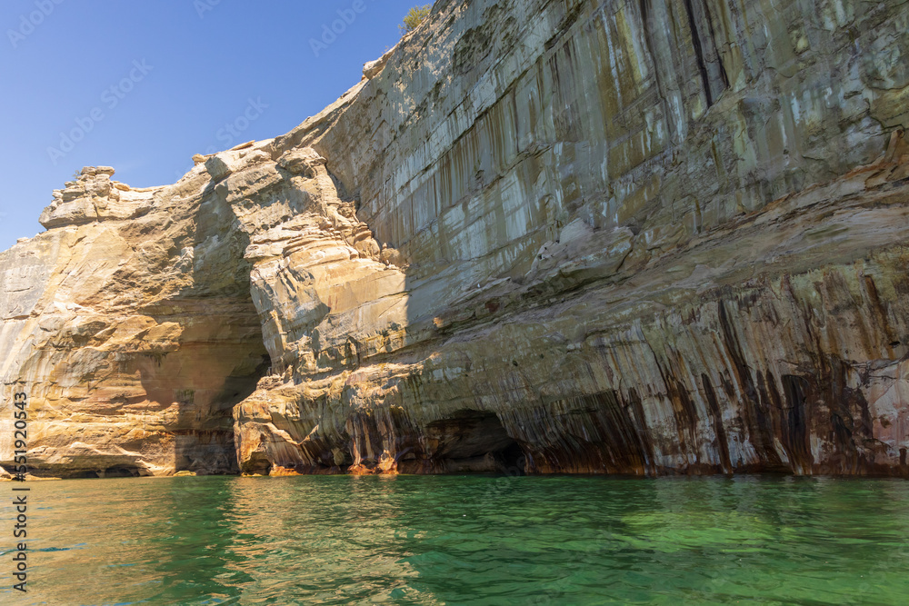 Natural arches and sea caves along Lake Superior at Pictured Rocks ...