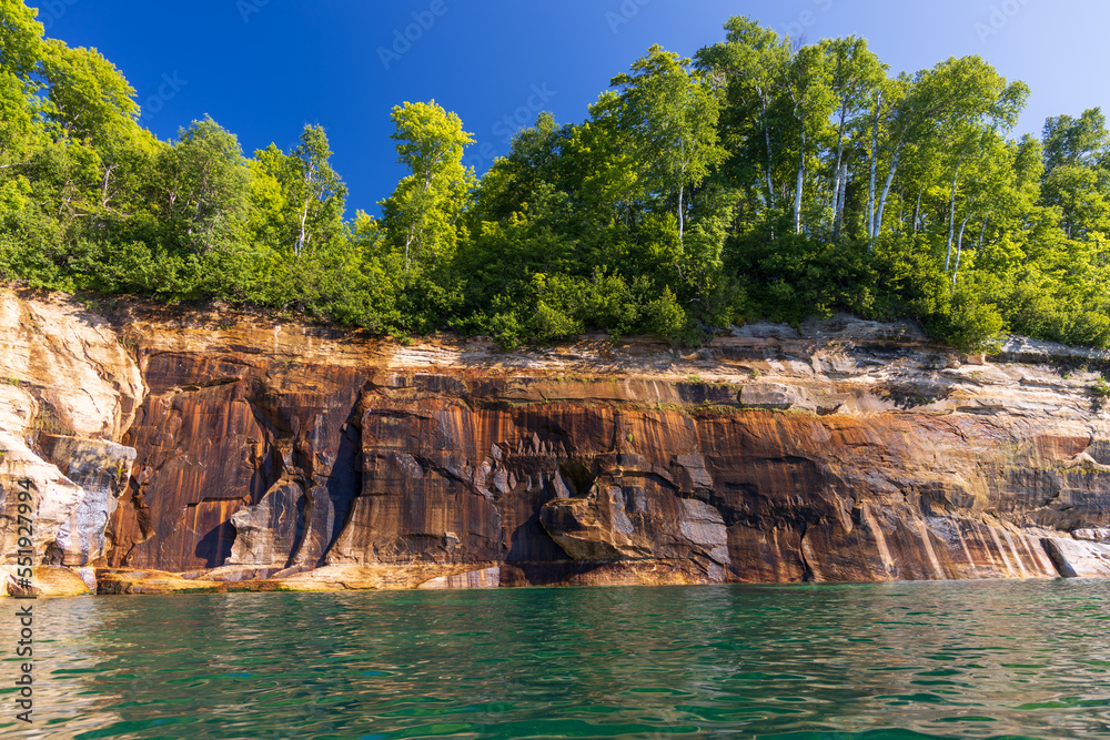 Natural arches and sea caves along Lake Superior at Pictured Rocks ...