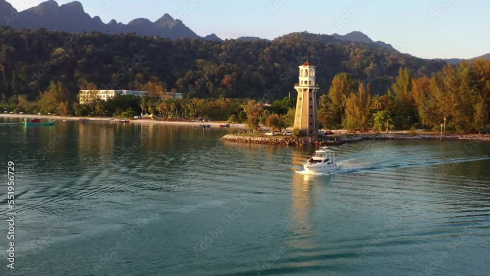 Cinematic aerial shot panning view capturing perdana quay light house ...