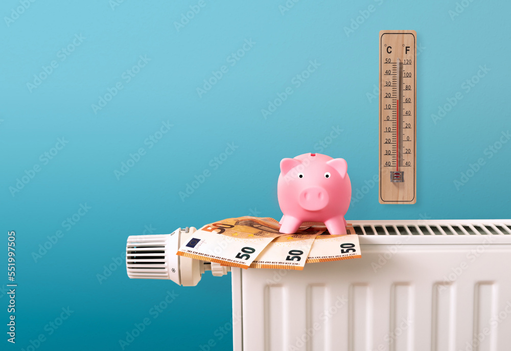 piggy bank with money bank notes, radiator and thermometer, heating ...