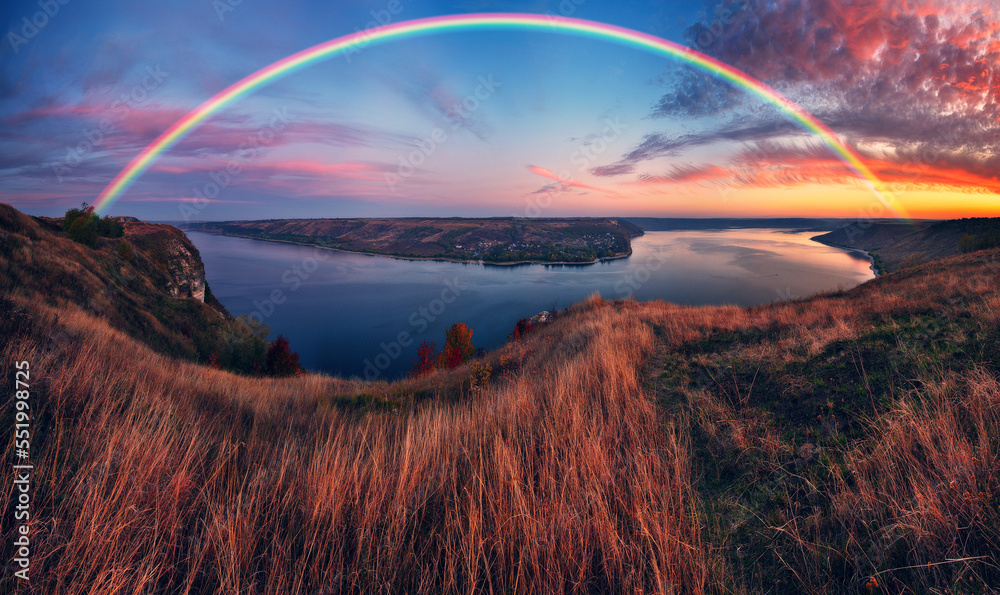 colorful rainbow over river canyon. autumn landscape. nature of Ukraine ...