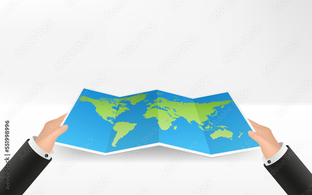 Hands holding paper map. Top view on folded map atlas in hands of men ...
