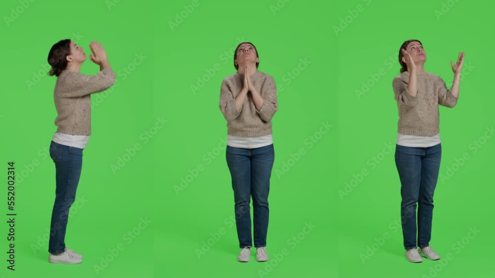 Young adult doing prayer hands symbol on full body green screen ...
