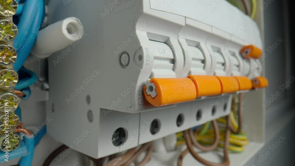 White electrical panel with wires, electrical parts, automatic switches ...