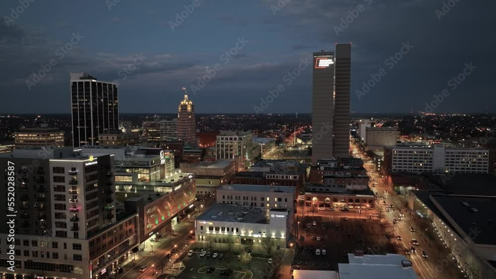 Fort Wayne, Indiana skyline at night close up with drone video circling ...