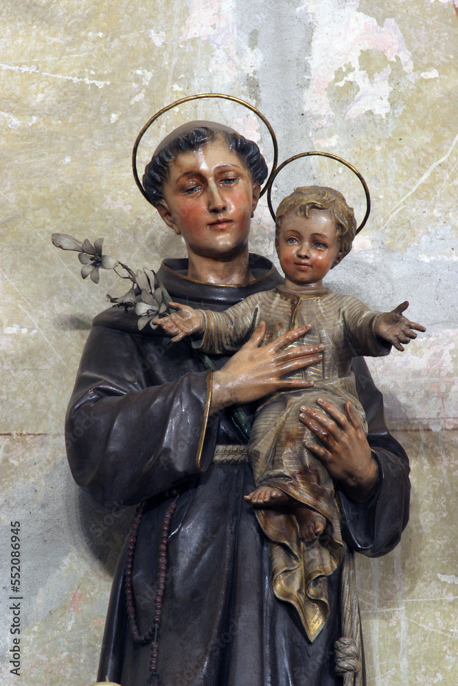 Saint Anthony of Padua holding baby Jesus, statue in the church of the ...