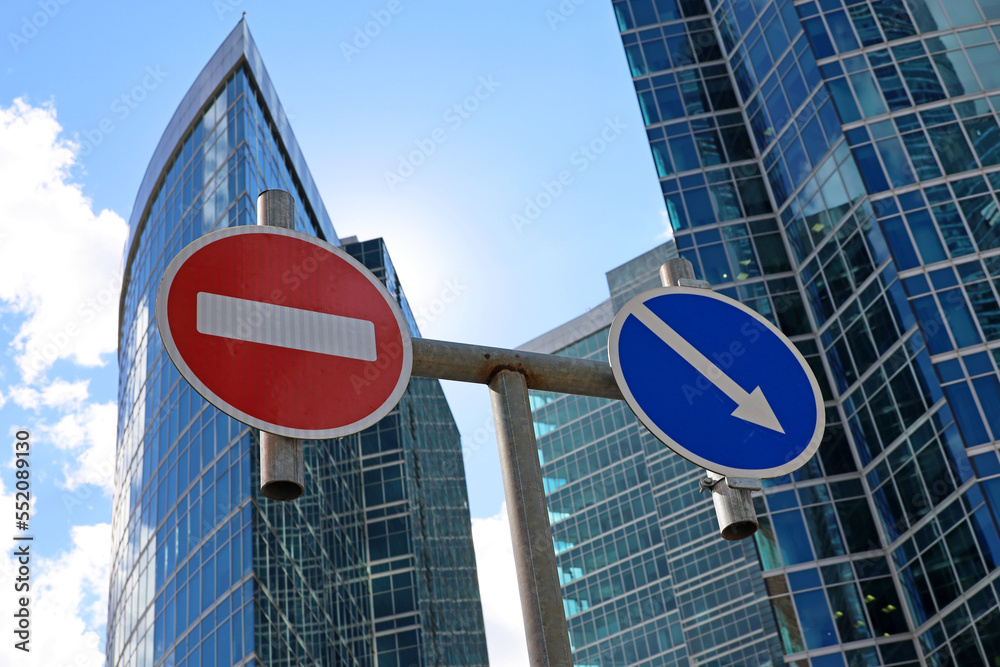 Poster No entry sign and detour obstacles sign on the skyscraper ...