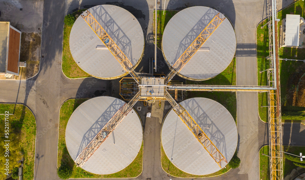 Aerial view of the tanks of a sewage and water treatment plant enabling ...
