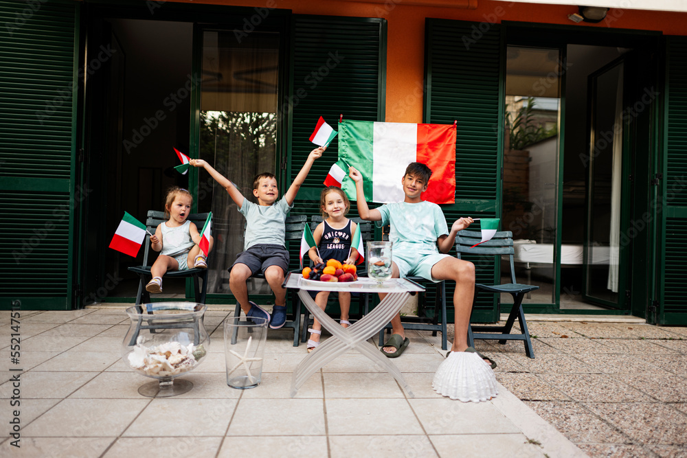 Happy four kids with italian flags celebrating Republic Day of Italy ...