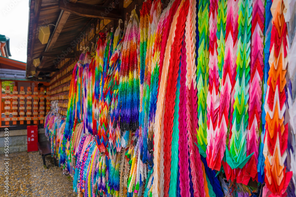 This image shows thousands of carefully folded origami paper cranes in ...