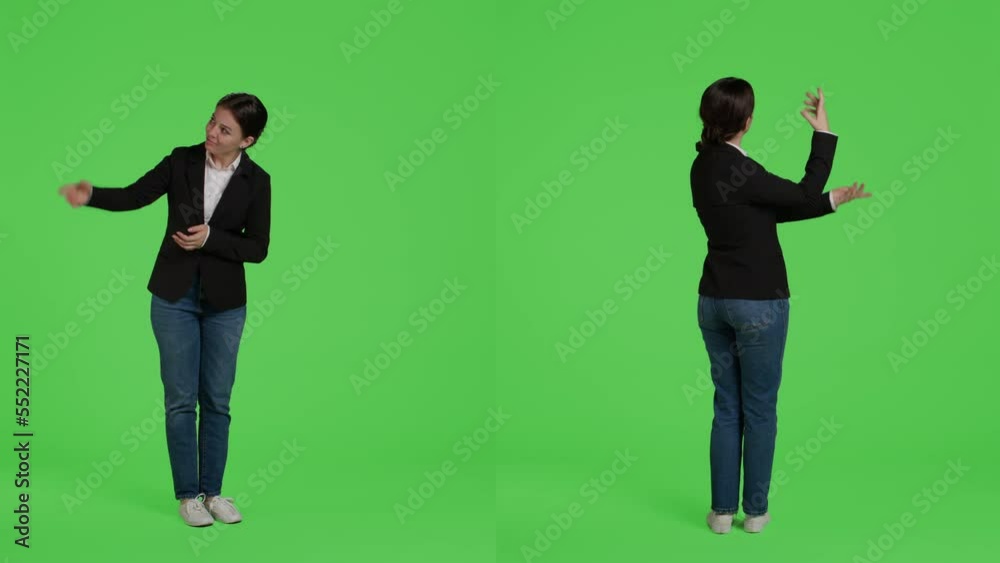 Corporate employee in suit doing advertisement over full body green ...