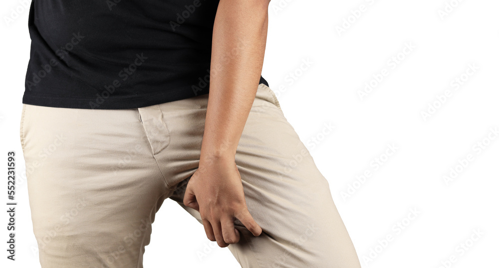 Asian man in reaction of scratching crotch on grey background, closeup ...