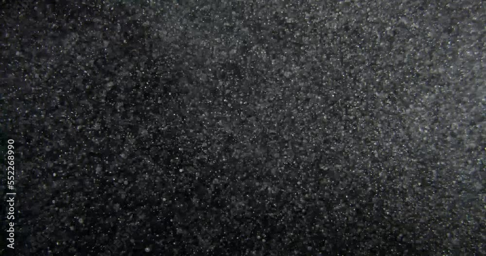 Atmospheric dust particles ambient on black screen overlay. Filmed with ...