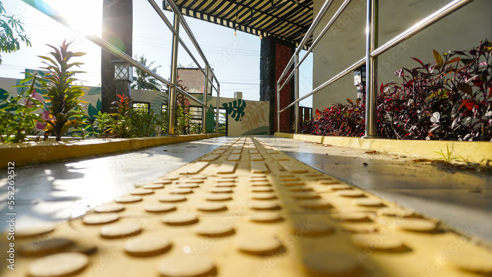 Yellow Braille blocks in common hallway for disabled people ...