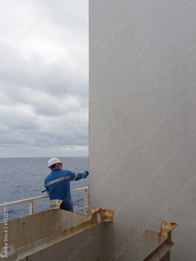 using rust remover for removing rust from ship crane Stock Photo ...