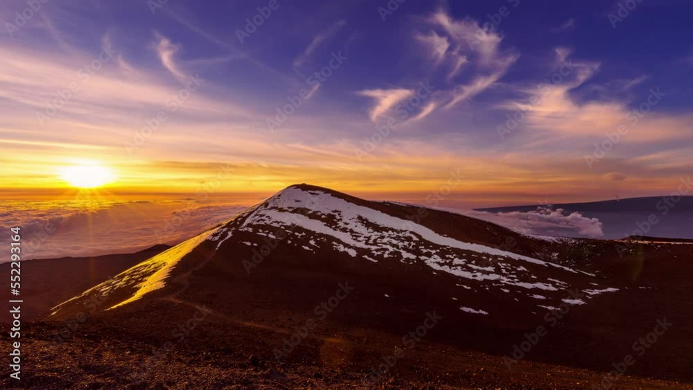 A beautiful scene of the sun rising with Mauna Loa eruption off in the ...