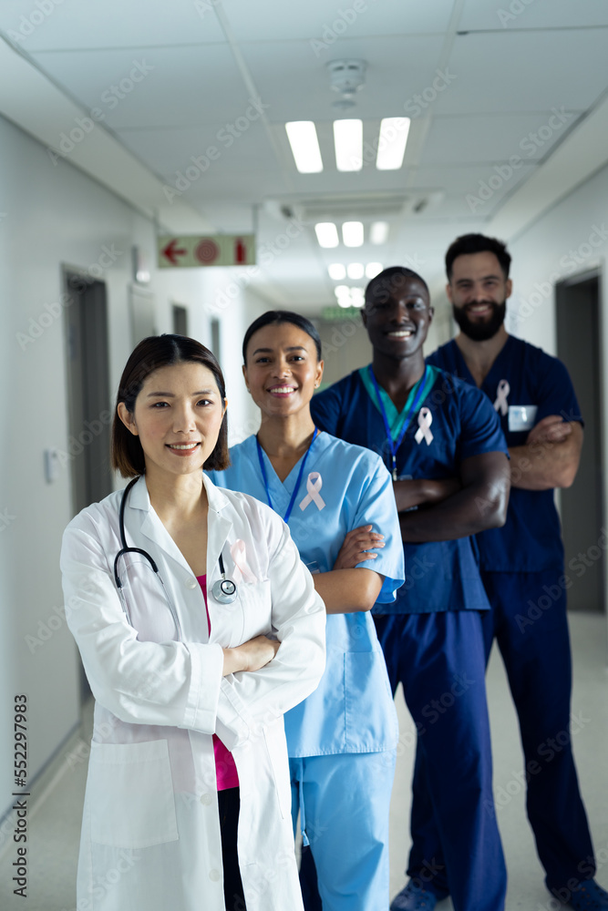 Vertical portrait of diverse group of smiling healthcare workers ...