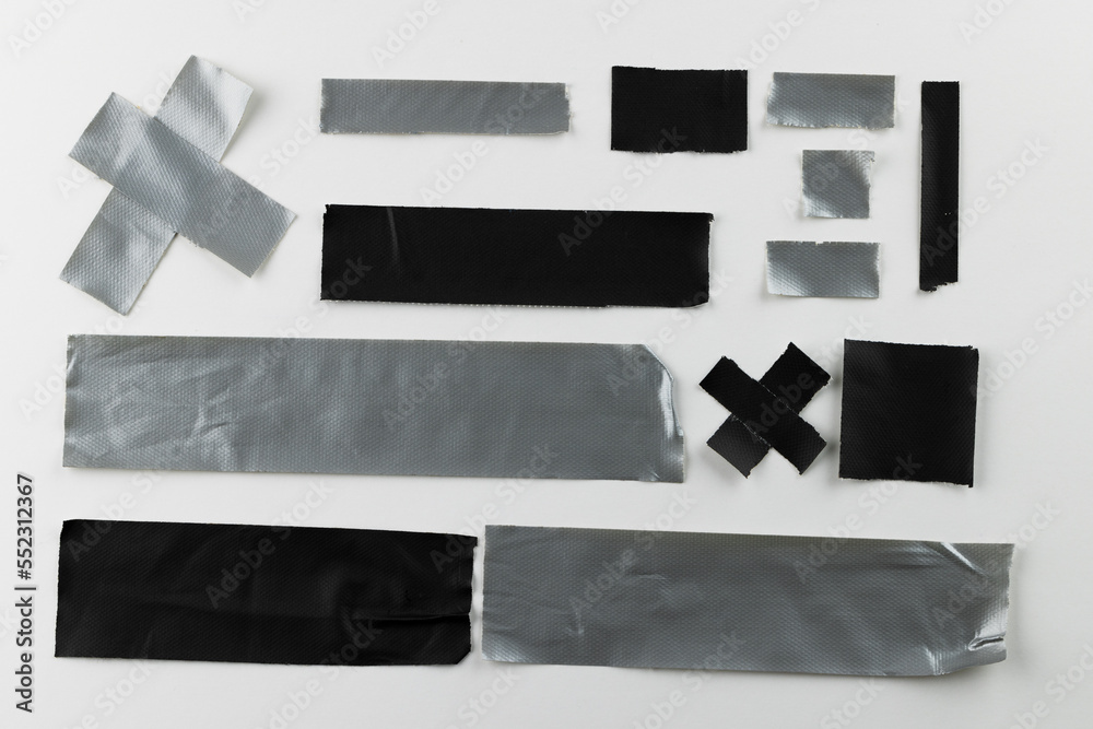 Ripped up pieces of masking tape with copy space on white background ...