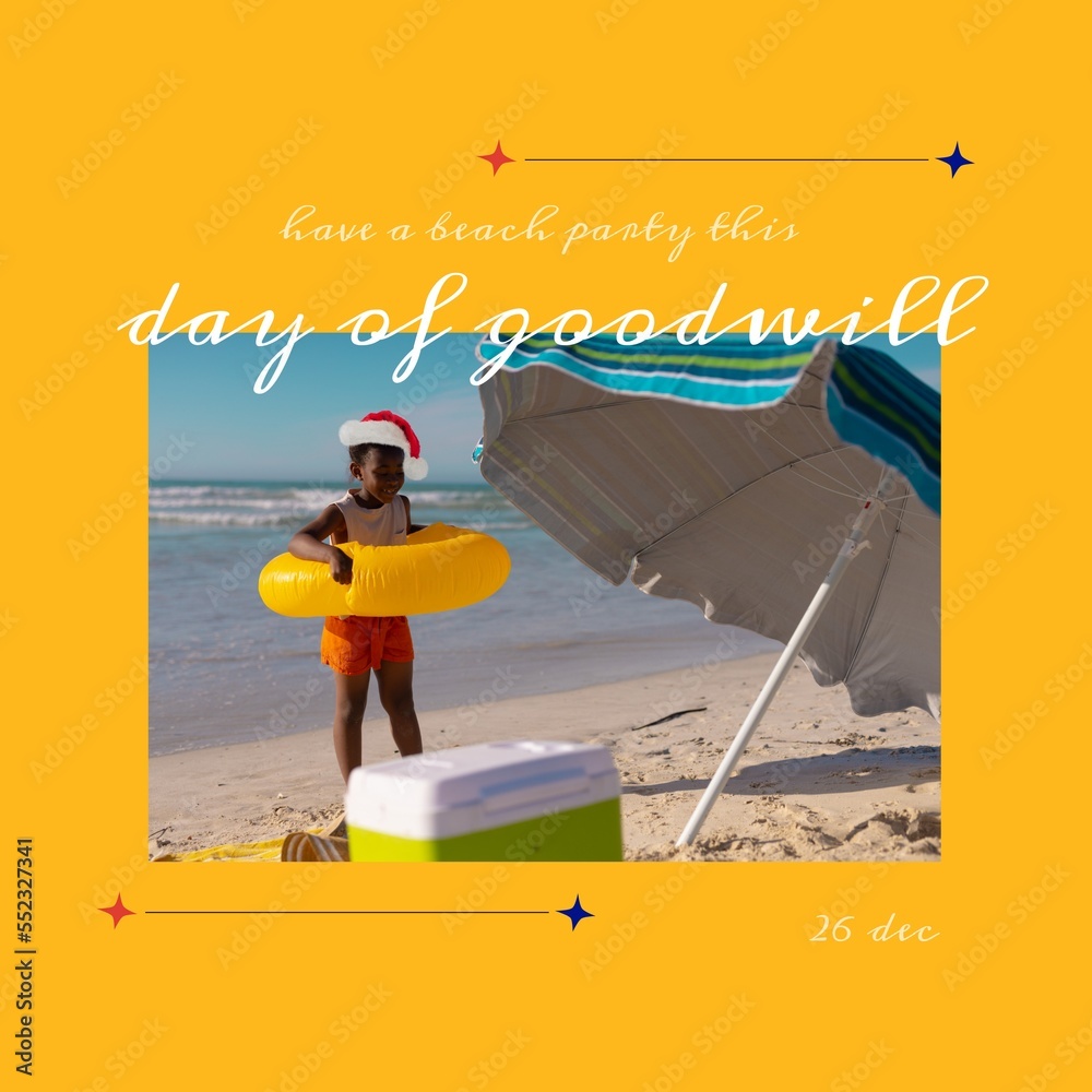 Composition of day of goodwill text with african american boy at beach ...