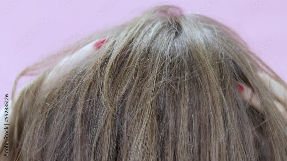 girl massaging scalp with both hands gray blonde long curly hair growth ...