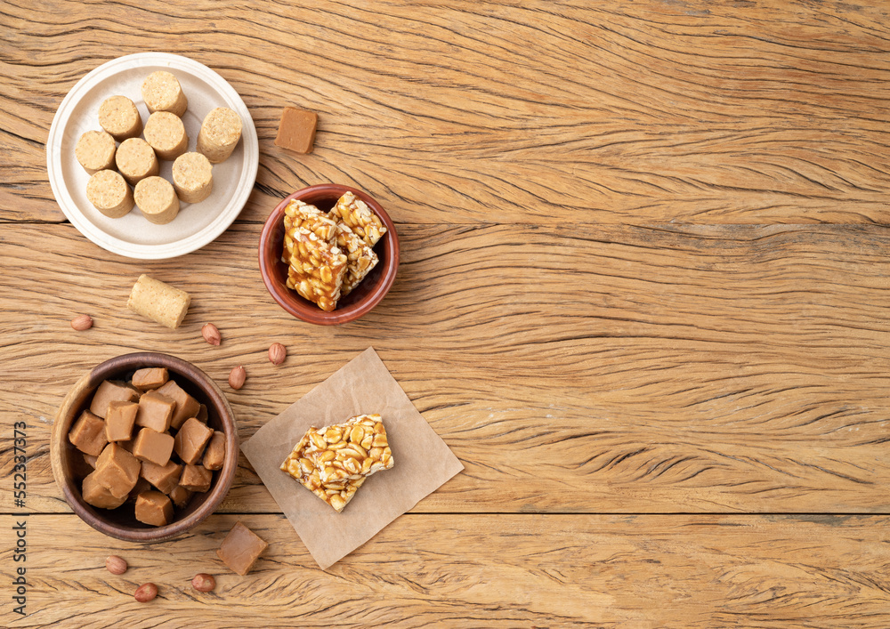 Typical brazilian candies over wooden table. Doce de leite or dulce de ...