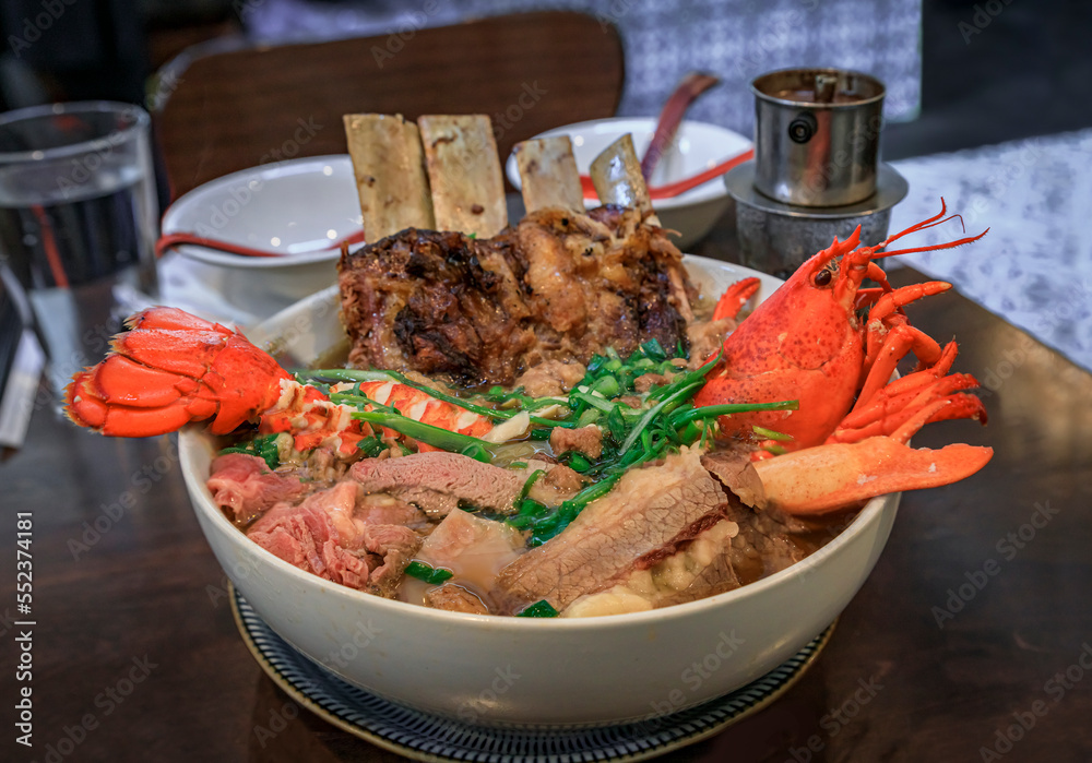 Gourmet exotic version of the Vietnamese pho soup with lobster, short ...