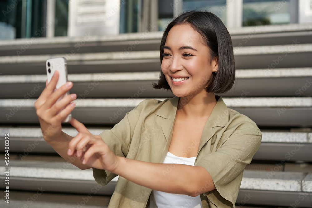 Portrait Of Asian Beautiful Girl Takes Selfie On Smartphone Young