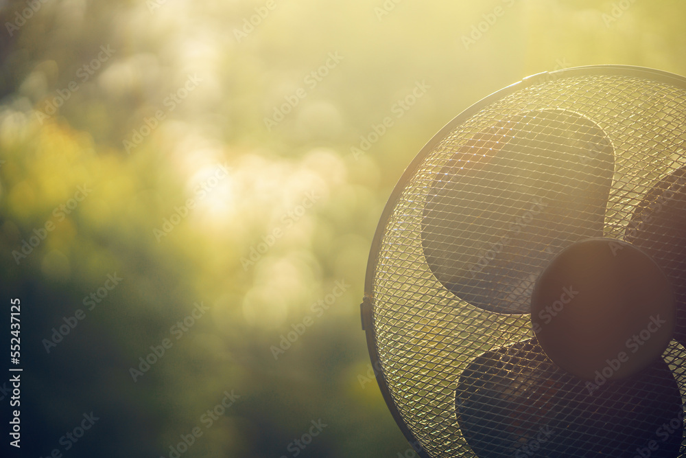 Fan blades in the sun. A hot summer day. Very hot weather. The coolness ...