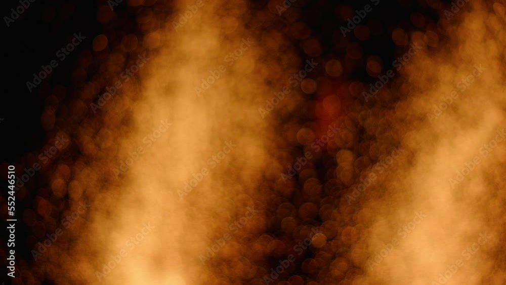 Bright sparks from fireshow in night sky out of focus effect abstract ...