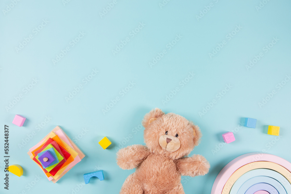 Baby kids educational toys frame background. Teddy bear, wooden ...