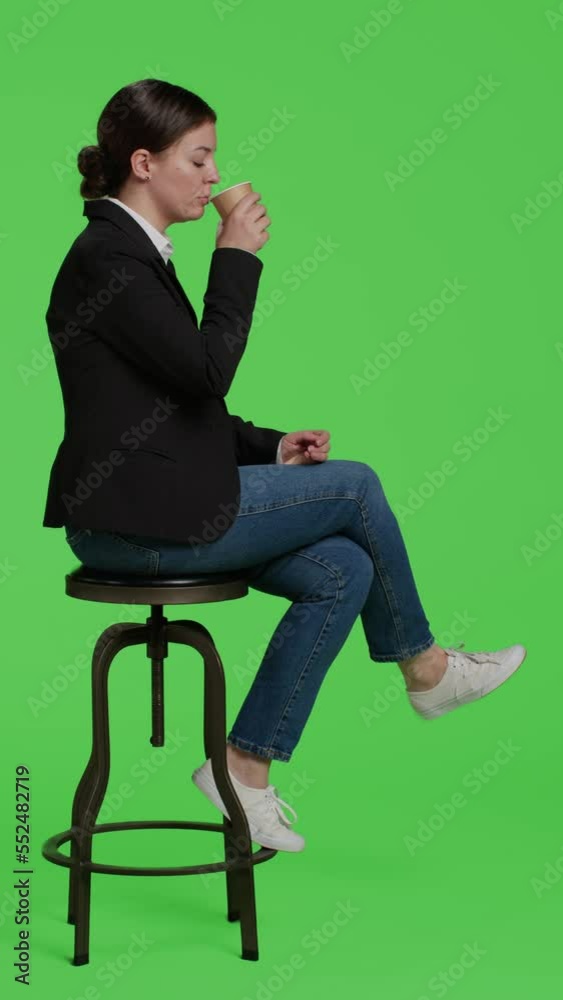 Vertical video: Profile of casual company worker drinking cup of coffee ...