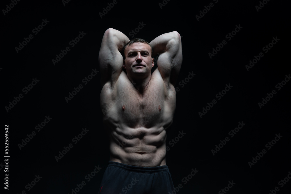 strong bodybuilder having muscular torso abs. photo of muscular ...