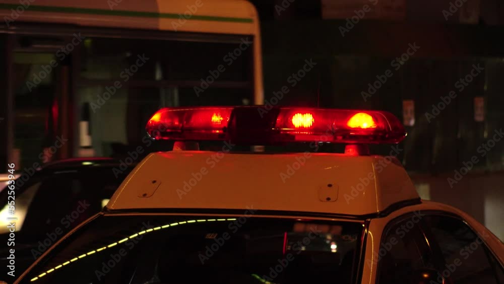 JAPAN : Close up shot of red rotating beacon light on police car and ...
