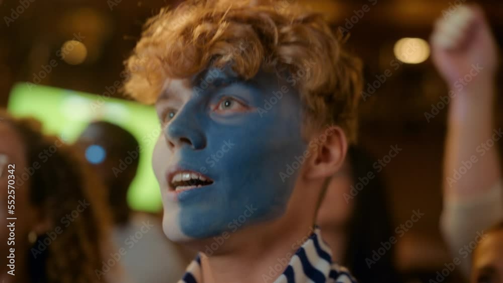 Close Up Portrait of a Handsome Young Soccer Fan with Painted Blue and ...