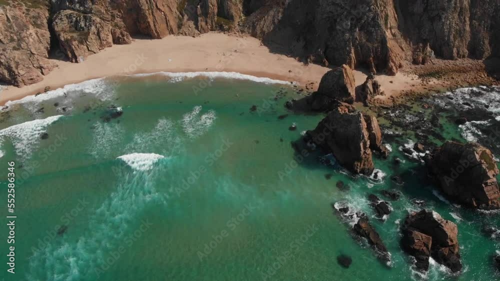 Drone footage of remote beach with its wide sandy coast. Stormy sea ...