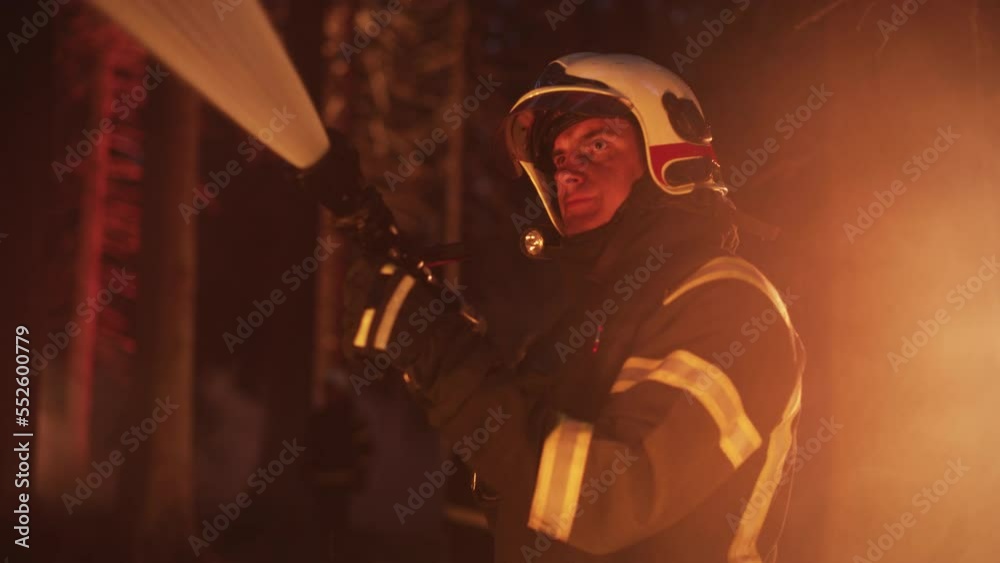 Experienced Firefighter Extinguishing a Wildland Fire Deep in a Forest ...